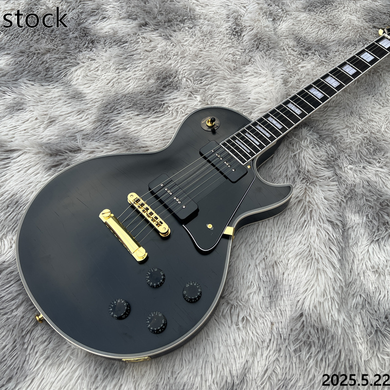 Electric guitar lp solid black p90 pickups aged check lines